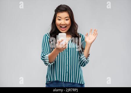 amazed and happy woman waving hand during video chat on laptop Stock ...