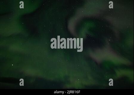 The aurora borealis is seen from the USCGC Bear (WMEC 901) as it ...