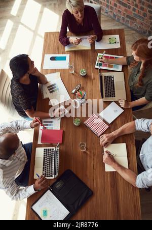 We do more when we work together. High angle shot of a team of ...