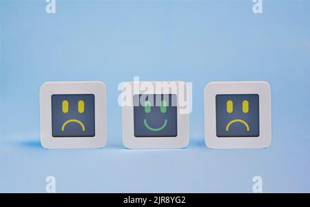 Set of computers with stylized faces of happy, sad and angry faces on ...