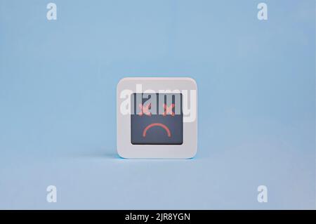 Dead face emoticon or icon on a ball on blue background. Missing web ...