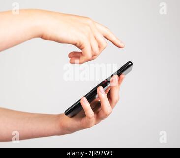 Close up of female hand scrolling on mouse pad of modern laptop ...