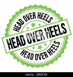 HEAD OVER HEELS text written on green-black grungy stamp sign Stock ...