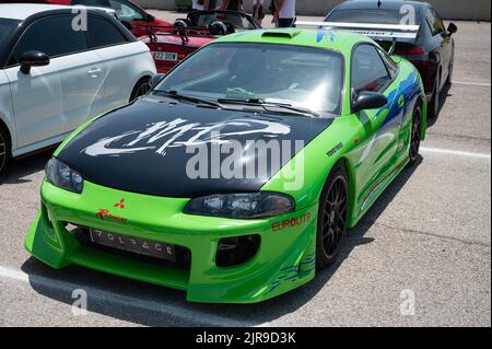 A second-generation green Mitsubishi Eclipse, tuned in style of Brian O ...