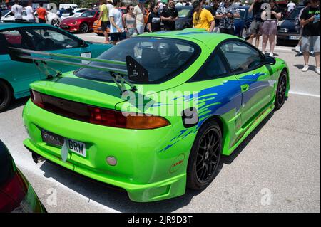 A second-generation green Mitsubishi Eclipse, tuned in style of Brian O ...