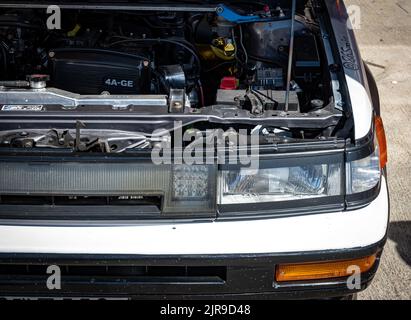 A closeup of a front detail of a Toyota Corolla Sprinter Trueno AE86 ...