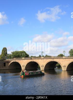 Narrowboat passing under Worcester bridge on the river Severn in ...