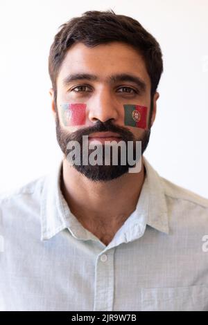 Image of serious multiracial man with flags of portugal on face Stock ...
