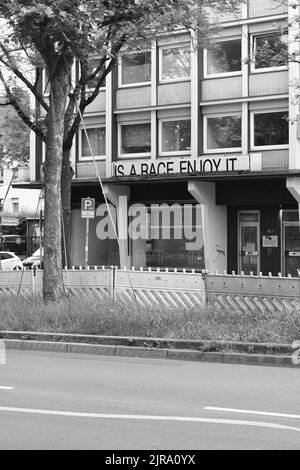 Vertical black and white shot of an 80s building with tile facade Stock ...