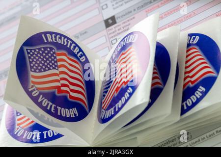 Stickers say "I registered to vote today" for the 2022 mid-term ...