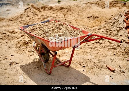 An old funny wheel barrow with only one handle, at a Thai temple Stock ...