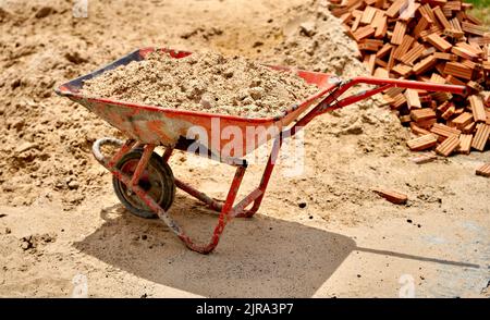 An old funny wheel barrow with only one handle, at a Thai temple Stock ...