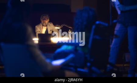 Theater actors with a disabled actress in a wheelchair with scripts ...