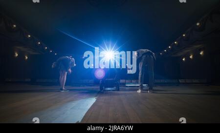 Professional actors bowing on stage in theatre, back view Stock Photo ...