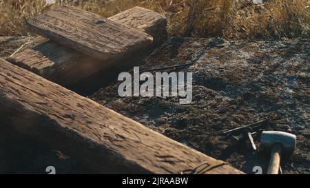 High angle of lumber cross for Jesus Christ execution placed on ground ...