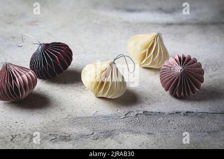 Paper handmade Christmas tree balls of different colors close-up on ...