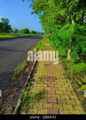 A Beautiful Shot Concrete Block Footpath Road Side In The Park Photo ...