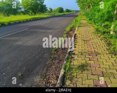 A Beautiful Shot Concrete Block Footpath Road Side In The Park Photo ...