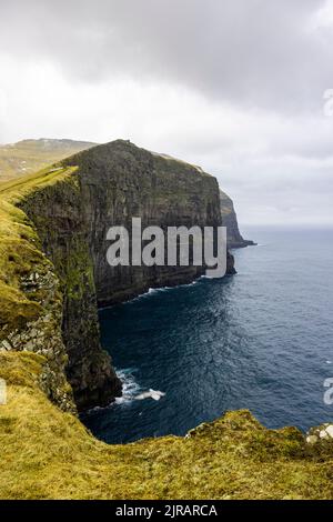 Steep cliffs of Faroe Islands. Vertical cliffs. Massive rocky cliffs ...