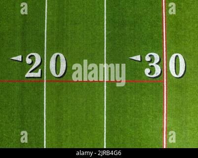 Synthetic turf football field, between the 20 and 30 yard lines in ...