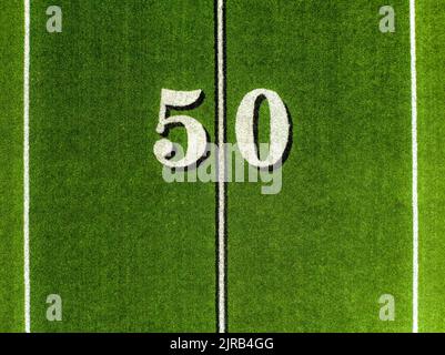 Synthetic turf slanted football 50 yard line in white with black number ...