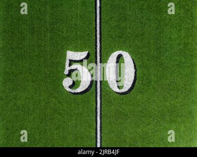 Synthetic turf slanted football 50 yard line in white with black number ...