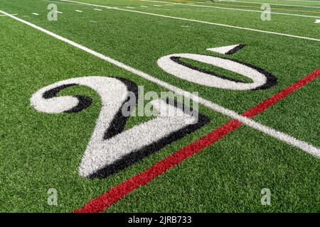 Synthetic turf football field twenty, 20, yard line in white Stock ...