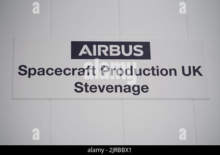 Members of staff work on the Biomass satellite at the Airbus factory in ...