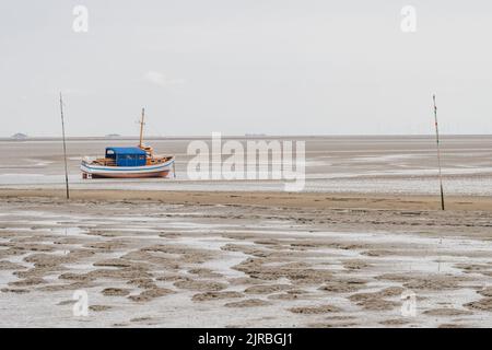 Germany, Schleswig-Holstein, Pellworm, Fishing boat at low tide Stock ...