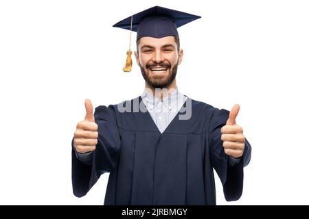 happy male graduate student showing thumbs up Stock Photo - Alamy