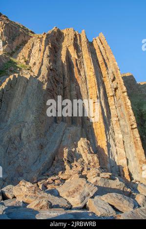 Rock fall and vertical strata at the Three Chimneys rock formation on ...