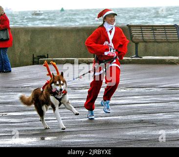 WAVES AND SPRAY BATTER HUNDREDS OF RUNNERS WHO BRAVED THE ELEMENTS IN ...