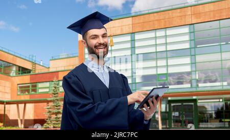 male graduate student or bachelor with tablet pc Stock Photo - Alamy