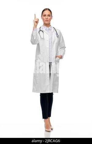 young doctor warning finger up isolated on white Stock Photo - Alamy