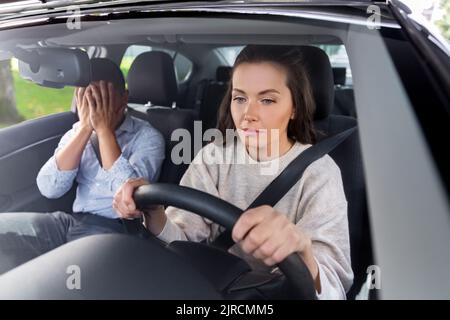 car driving school instructor teaching male driver Stock Photo - Alamy