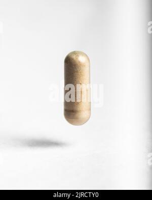Floating Vitamin pills, abstract shot Stock Photo - Alamy