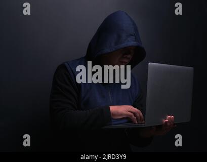 Hackers are the masters of stealth. an unrecognisable hacker using a ...