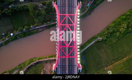 Aerial view of the Kalikuto Bridge, an Iconic Red Bridge at Trans Java ...