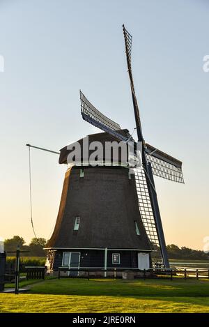 Breezand, Netherlands. August 2022. A Dutch windmill in the polder with ...