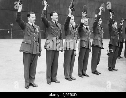 RAF pilots cheer King George VI at an awards ceremony at RAF Hornchurch ...