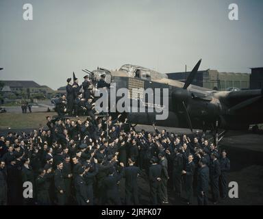 Aircrew and ground staff of No. 467 Squadron, RAAF, celebrate the ...