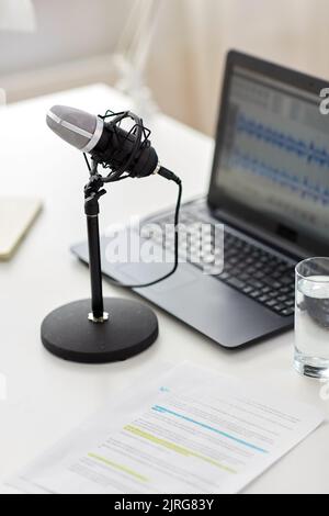 Microphone and mixer on the table. Recording studio, radio podcast ...
