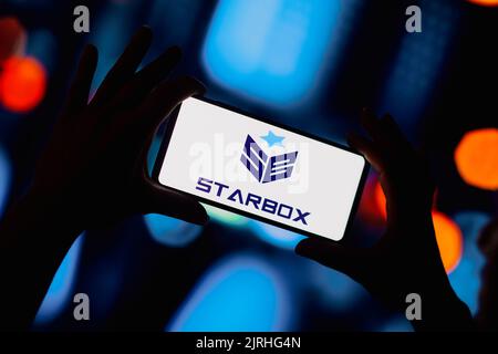 In this photo illustration, the StarBox Holdings logo is displayed on a ...
