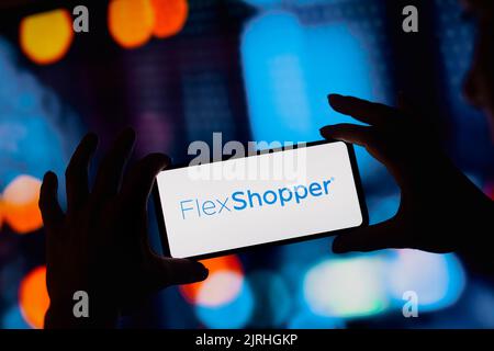 In this photo illustration, the FlexShopper logo is displayed on a ...