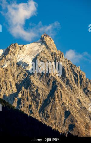 The panorama of Les Aiguilles towers in sunset light - Grands Charmoz ...