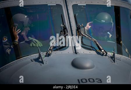 Lt. Col. Mary Clark and David Arrington, 96th Test Wing pilots, adjust ...