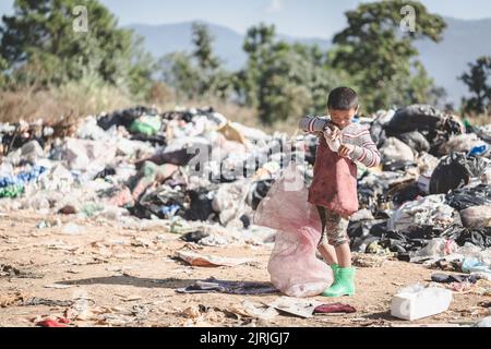 rag picker boy with garbage collection bag on shoulder, Mumbai ...