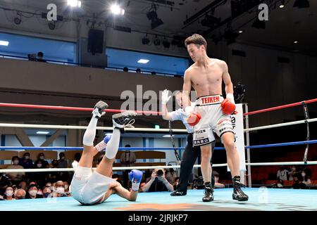 Gonte Lee (red gloves) and Moo Hyun Kim (blue gloves) compete during ...