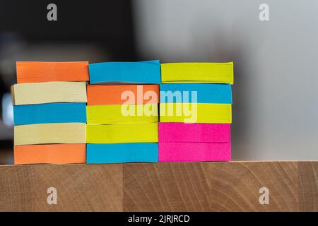 pile of sticky notes on office table at work Stock Photo - Alamy