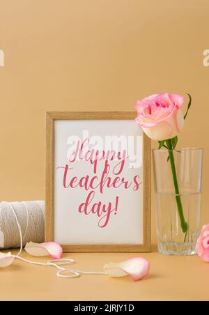 Delicate pink roses with spool of white cotton rope in heart shape on ...